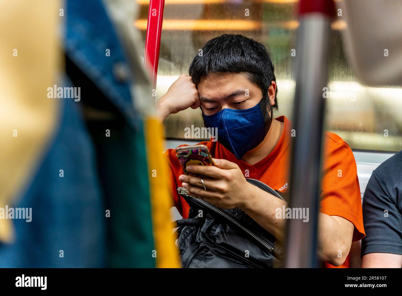 People Using Their Smartphones On A MTR Train, Hong Kong, China Stock ...