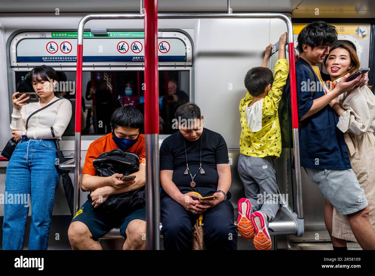 Passengers On A MTR Train, Hong Kong, China Stock Photo - Alamy