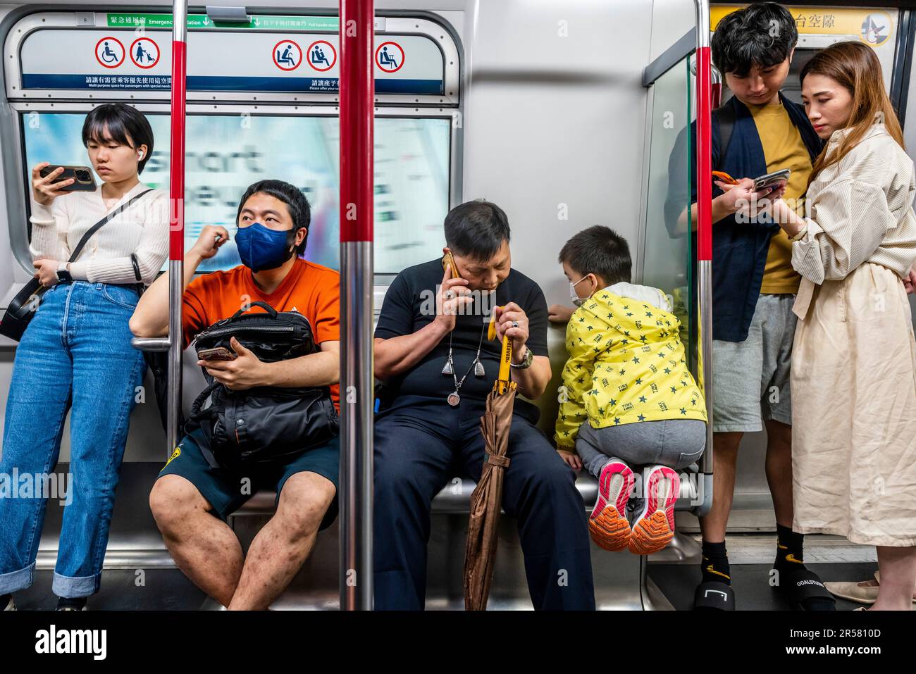 Passengers On A MTR Train, Hong Kong, China Stock Photo - Alamy