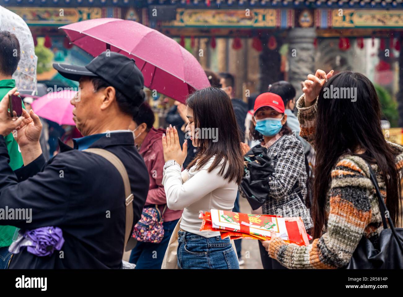 Young Chinese Worshippers At The Wong Tai Sin Temple, Hong Kong, China ...