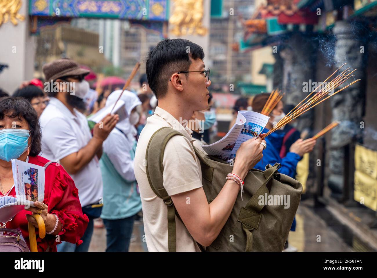 Young Chinese People Worshipping At The Wong Tai Sin Temple, Hong Kong ...