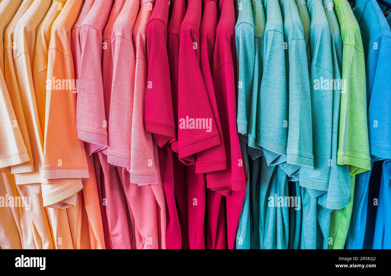 Fashion clothing on clothes rack - bright colorful wardrobe Stock Photo ...