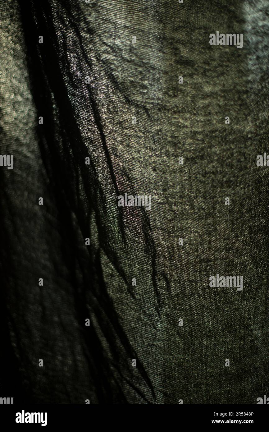 Curtains on window. Light through dark fabric. Texture of fabric in ...