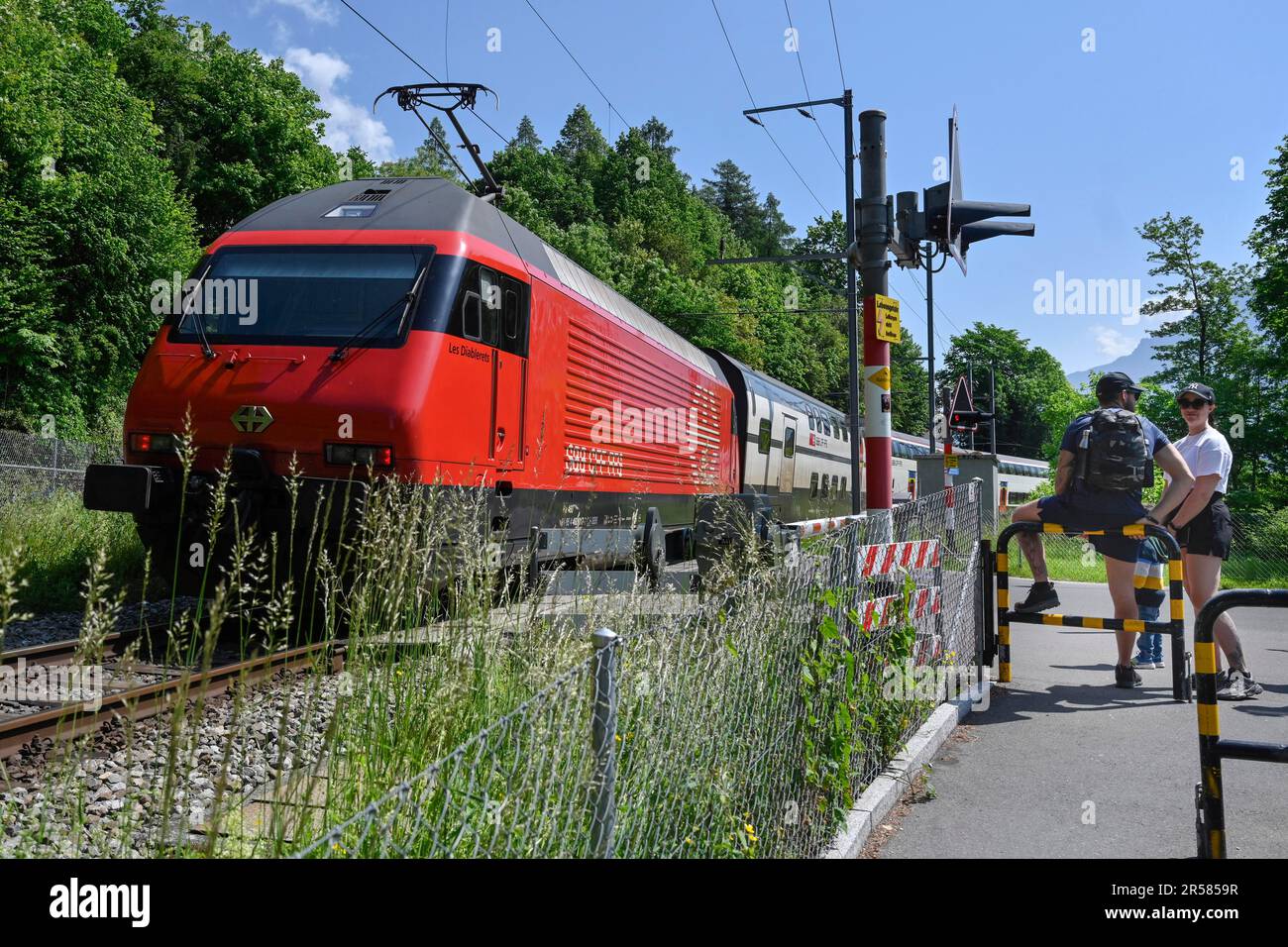 Level crossing SBB passenger train, Switzerland Stock Photo - Alamy