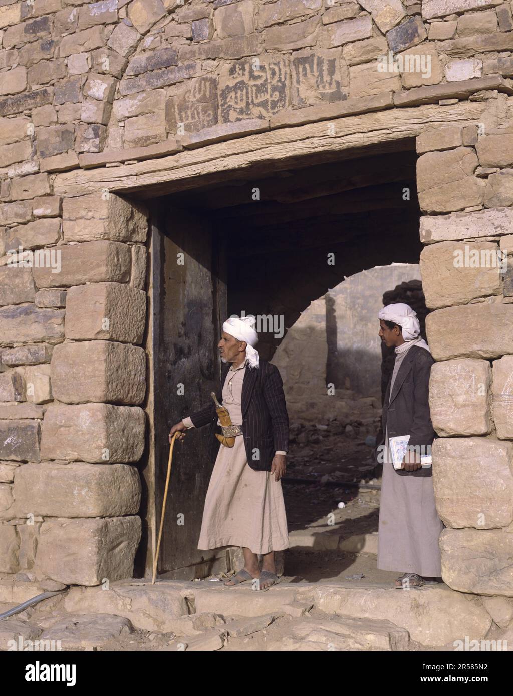 Two people in traditional dress at the city wall of Thula, Thulla ...