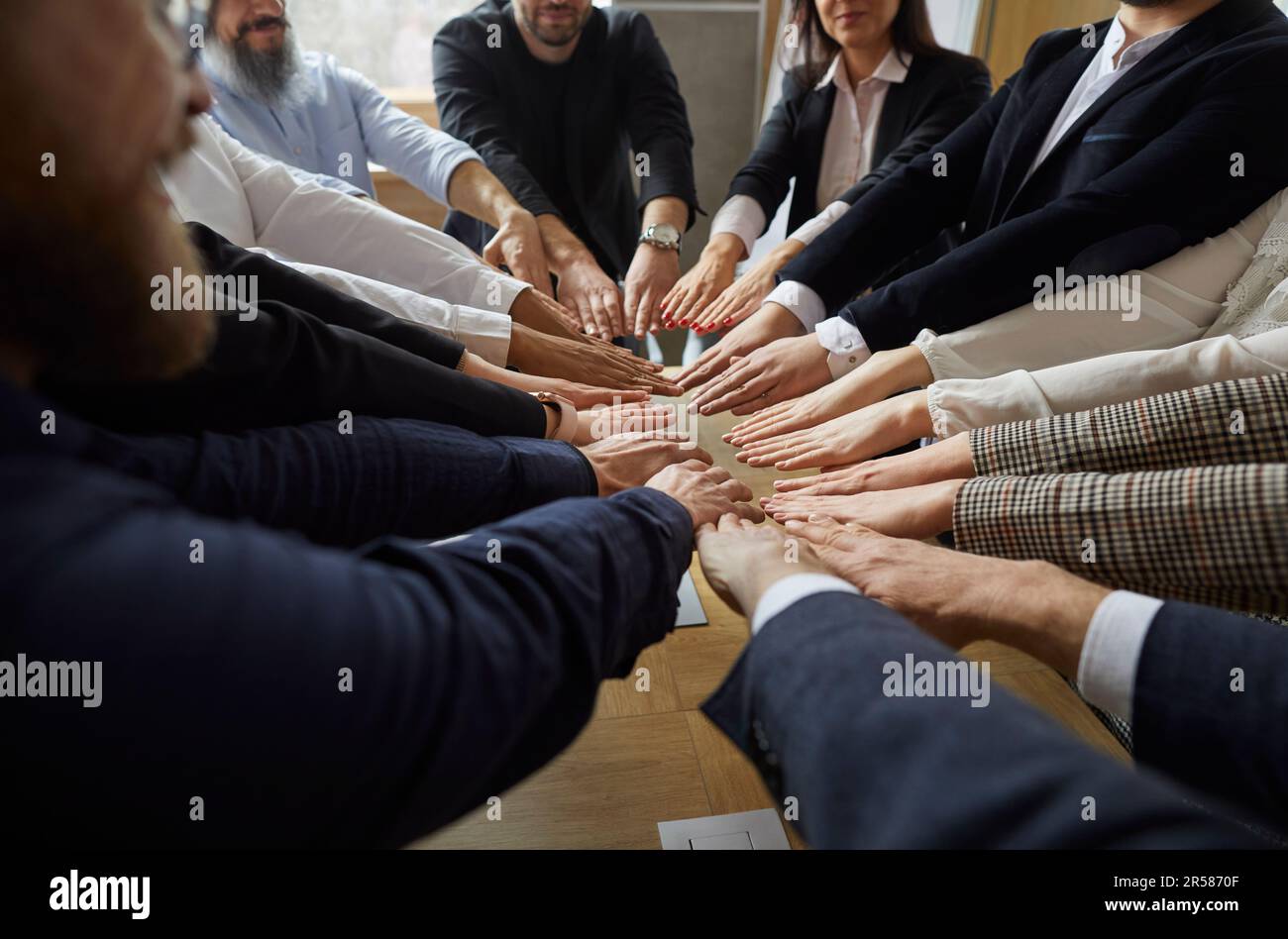 Group of business people holding hands together. Working team putting ...