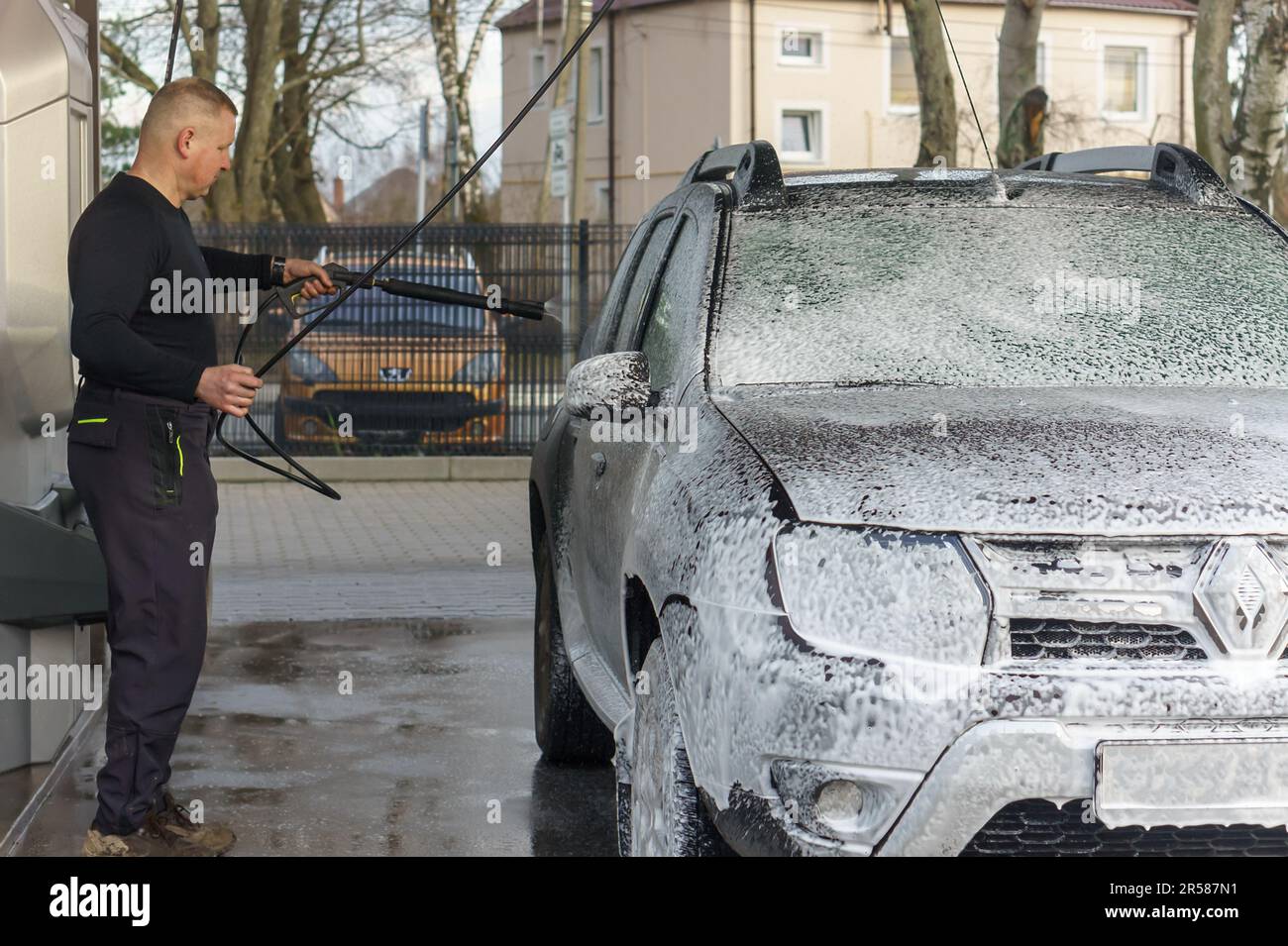 Kaliningrad, Russia, March 1, 2020. A man washes his car at a touchless ...