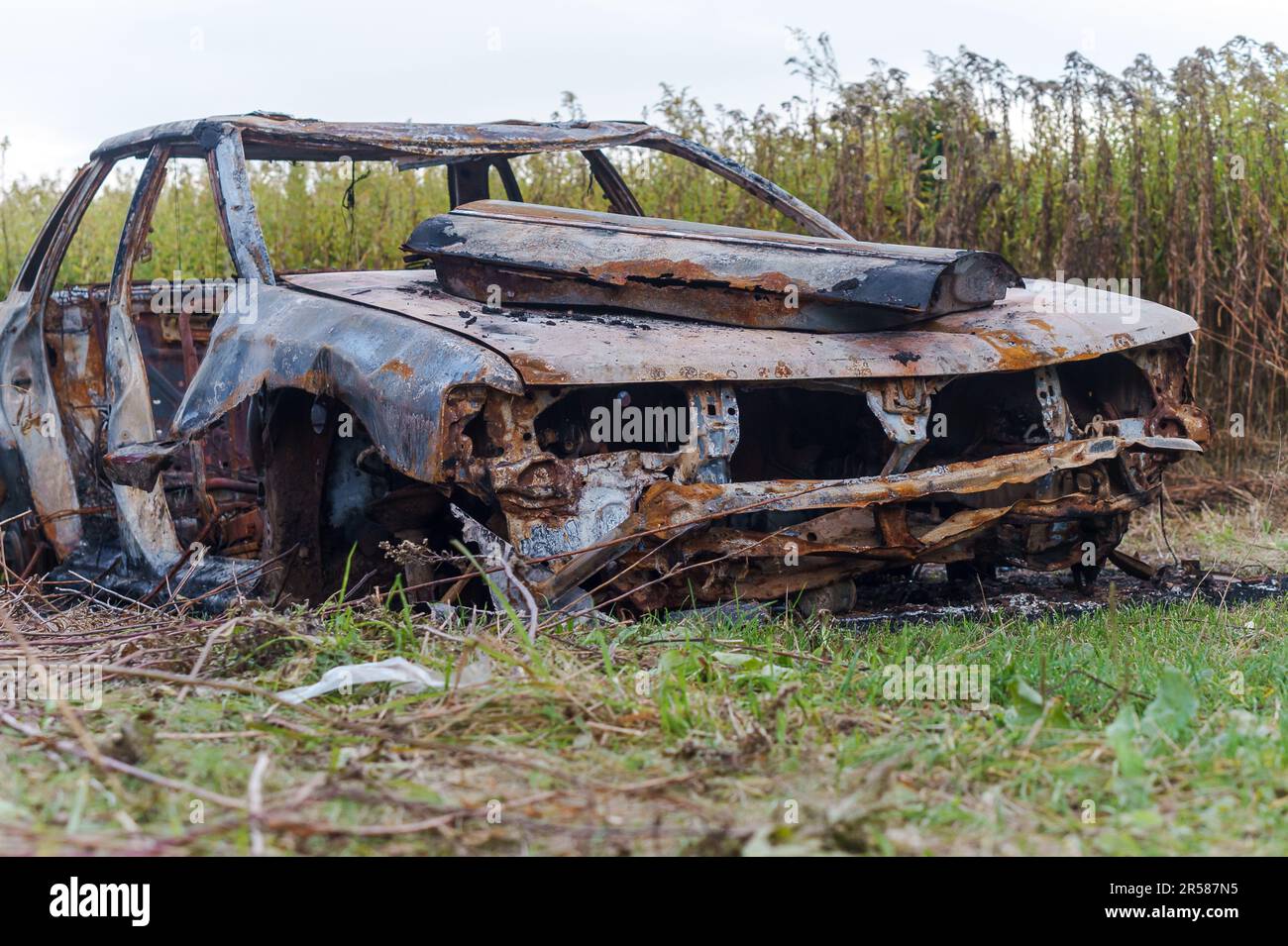 A burnt-out car. Car old burned by fire. Fire burned car Stock Photo ...