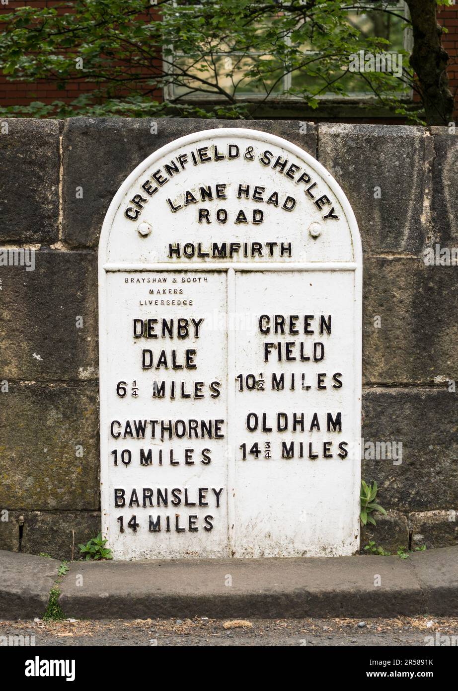 A traditional cast iron road sign in Holmfirth, West Yorkshire, England ...