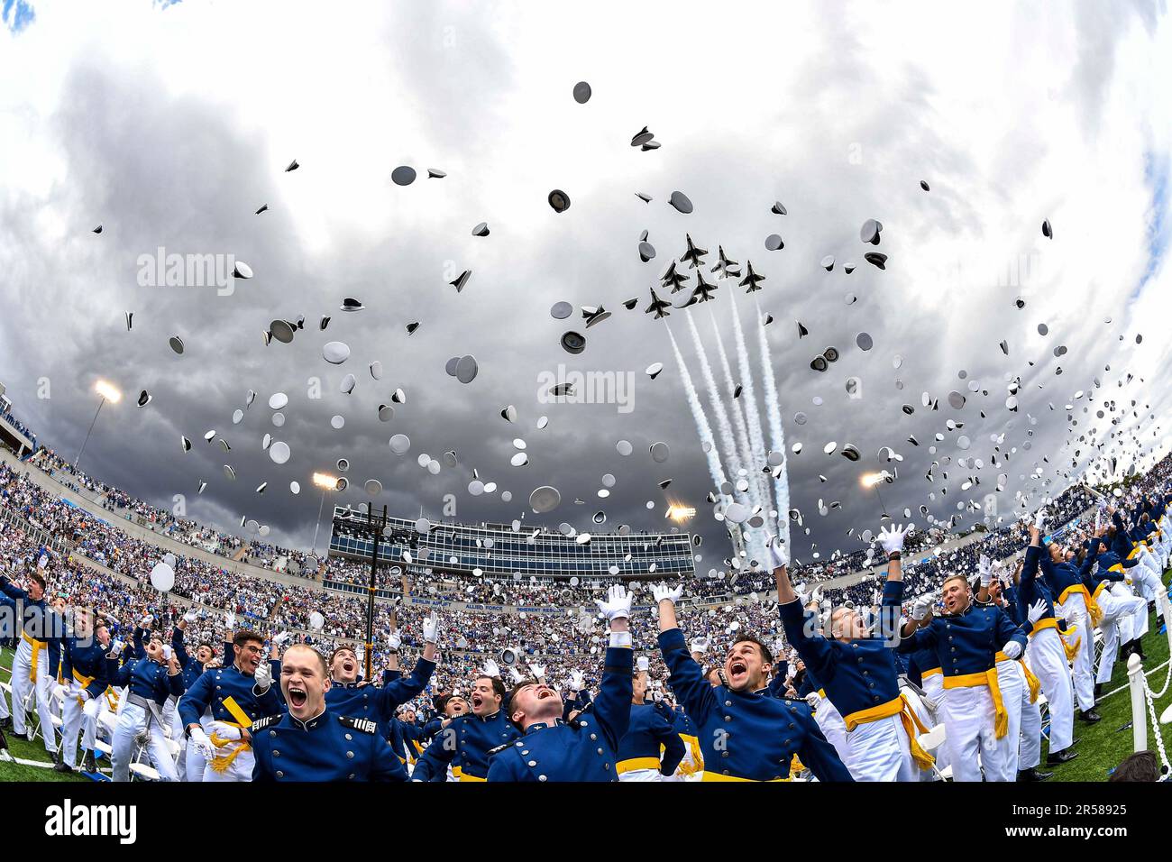 Air Force Cadets toss their caps in the air as the Thunderbirds fly ...