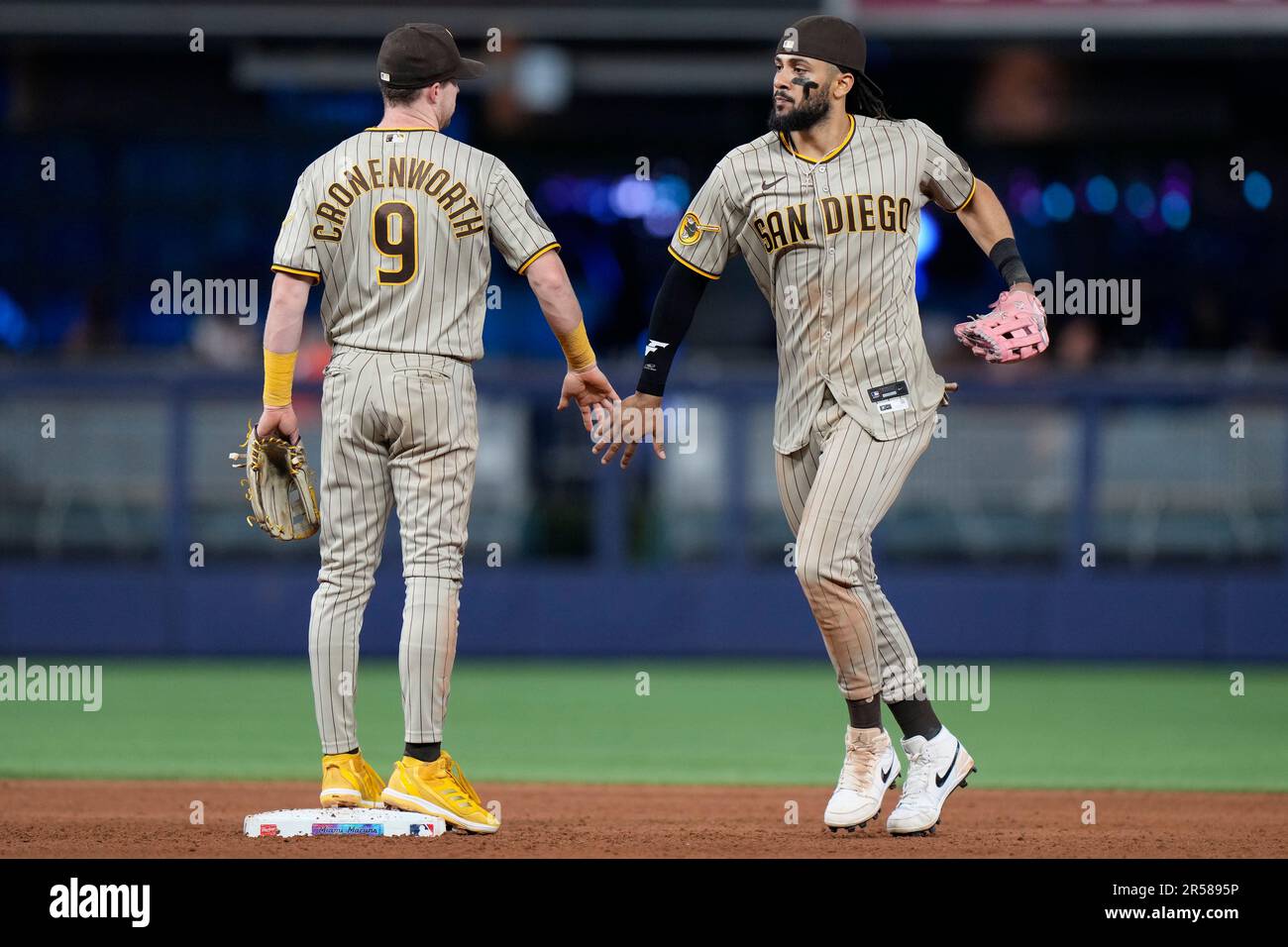 San Diego Padres right fielder Fernando Tatis Jr., right, and second ...