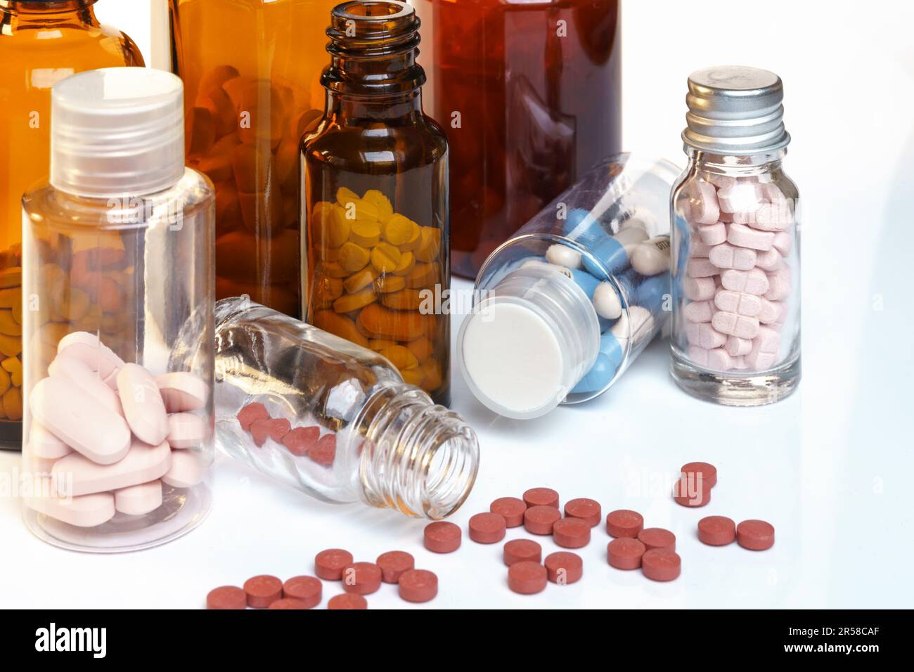 Group of bottles of medicine with pills Stock Photo - Alamy