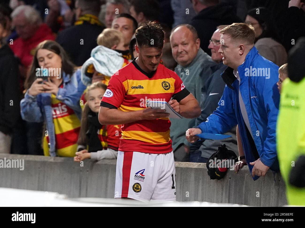 Partick Thistle's Daniel Mullen signs an autograph book after the cinch ...
