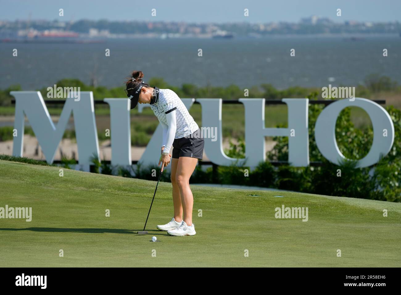 Lydia Ko, of New Zealand, sinks her birdie putt on the 18th green ...