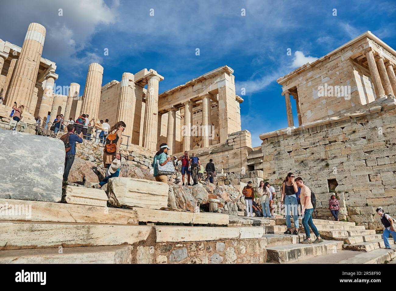 Acropolis of Athens, entrance gate pillars with tourists Stock Photo ...