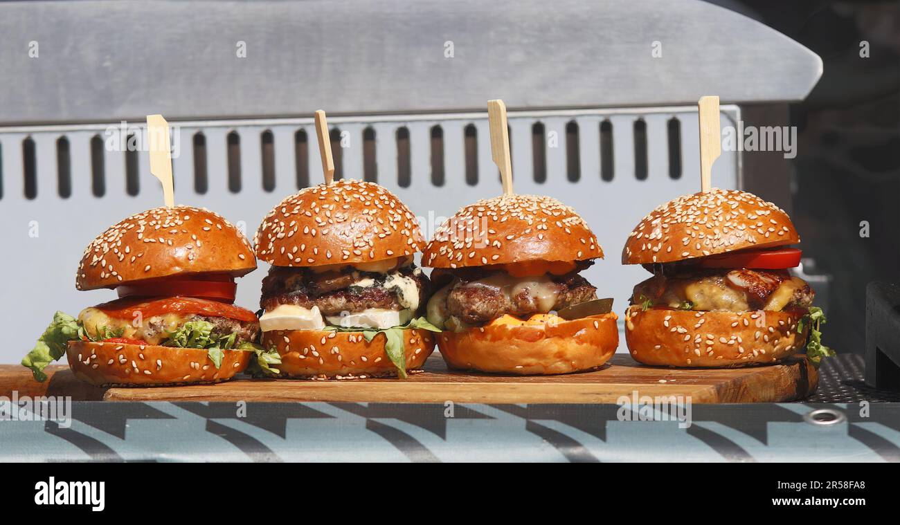 A variation of burgers displayed in a snack stand at the Karlin Street ...