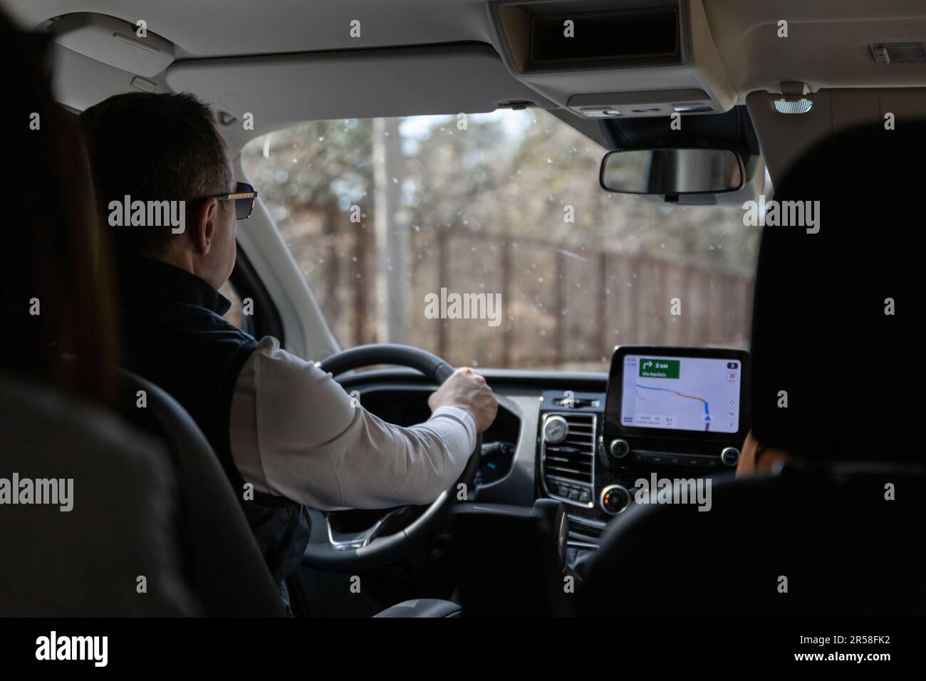 man driving car with the help of navigation Stock Photo - Alamy
