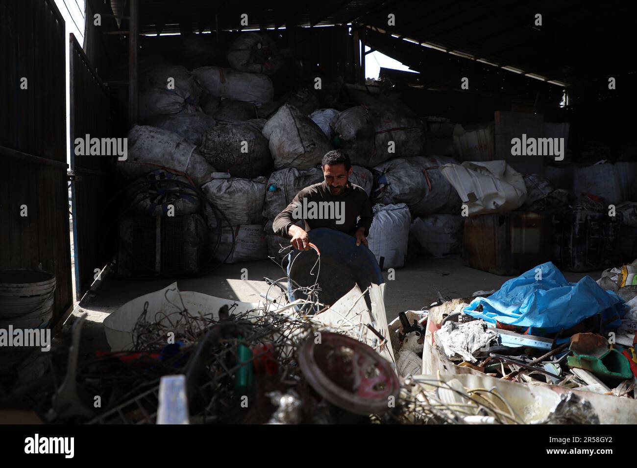 Gaza. 1st June, 2023. A Palestinian man works at a plastic waste ...