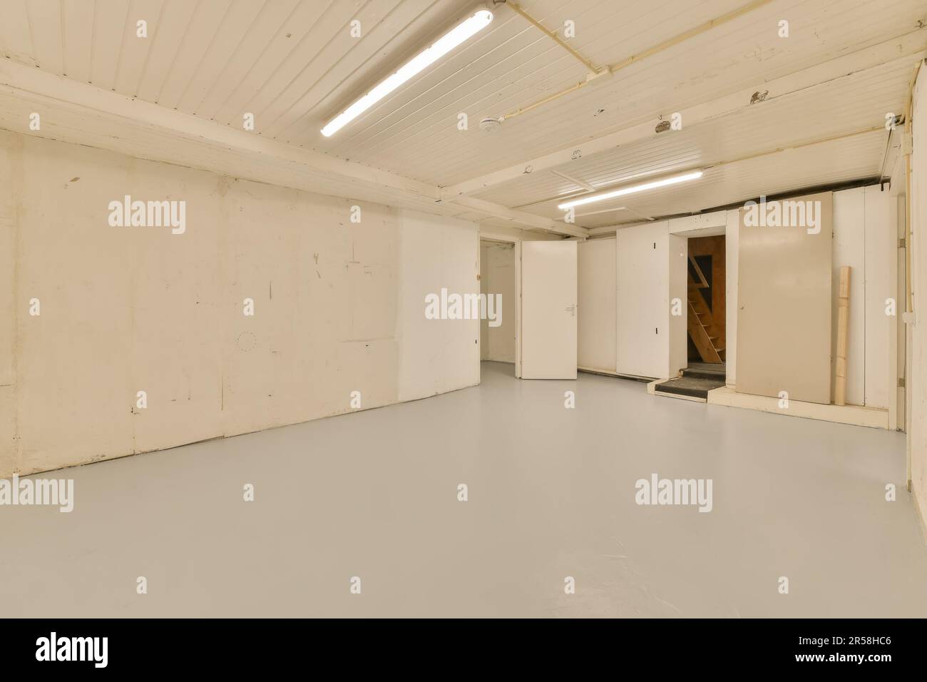 an empty room with white walls and dry paint on the floor, as if it's ...