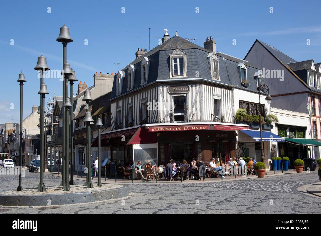Corner cafe in the centre of Deauville with Normandy style architecture ...