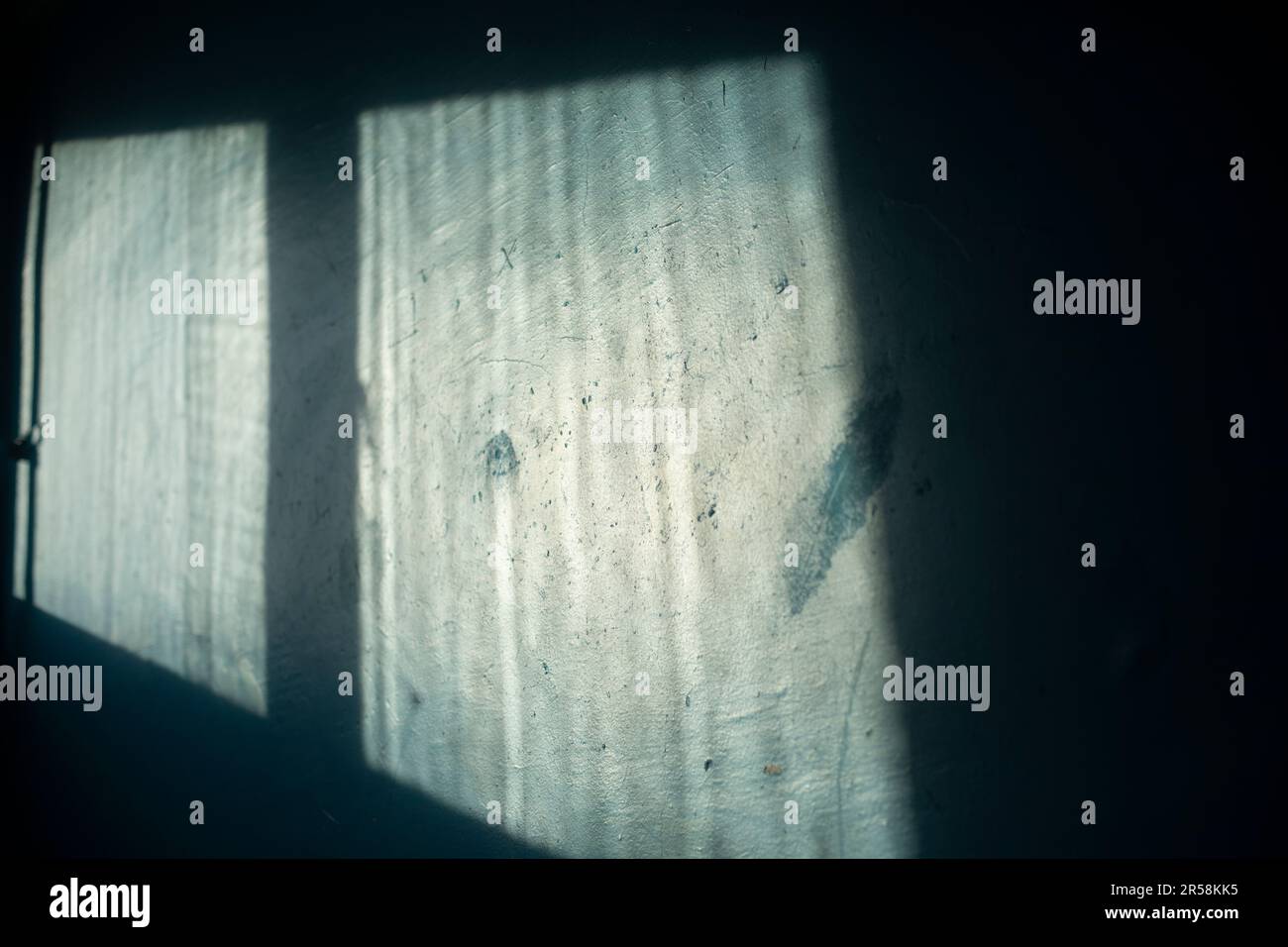 Light from window on wall. Light on blue wall. Interior details. Deep ...