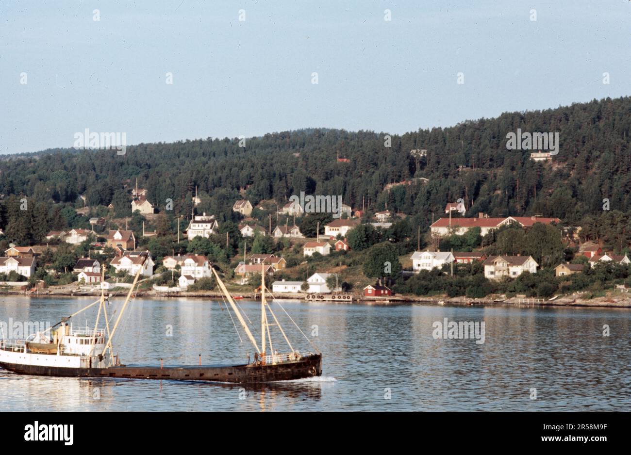Oslo, Norway- September 1973: Fishing vessel Bene. Town scene on hill ...