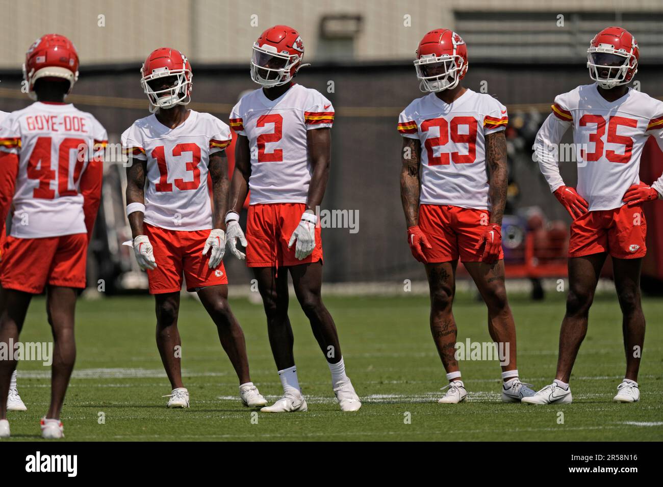 Kansas City Chiefs defensive players listen to instructions during the ...