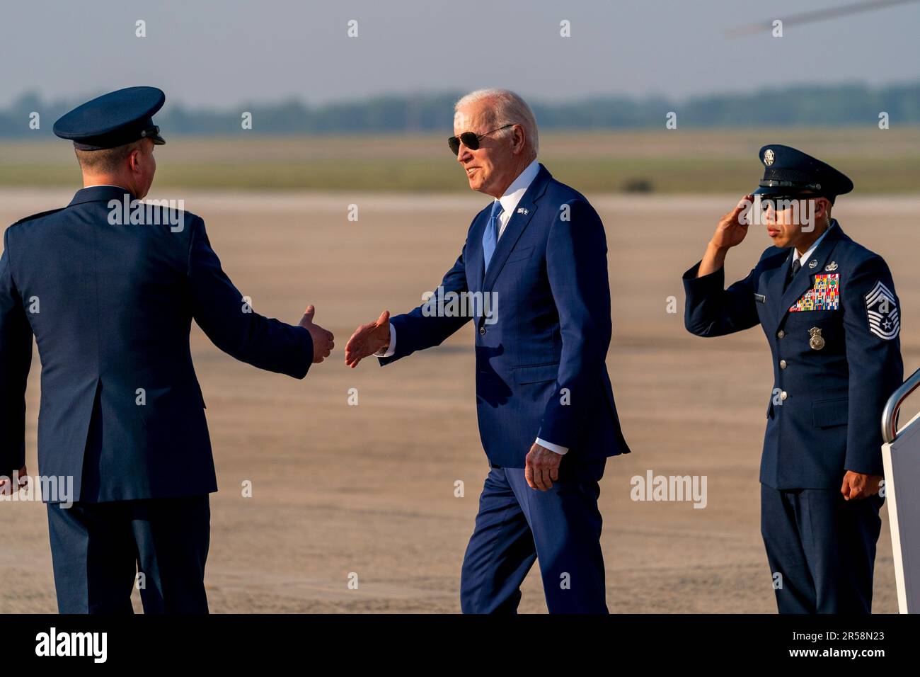President Joe Biden is greeted by 89th Airlift Wing Commander Col ...