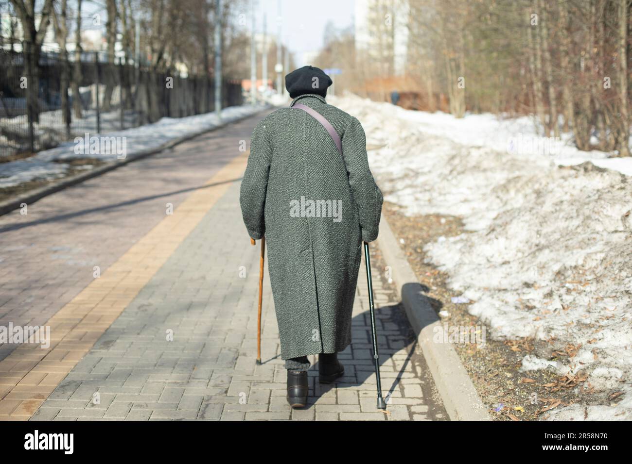 Pensioner Walks Down Road Elderly Woman On Street Walk In Park Old