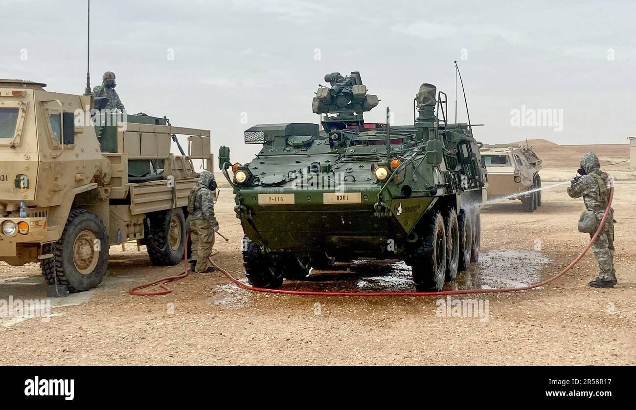 U.S. Army Soldiers practice the decontamination process by simulating ...