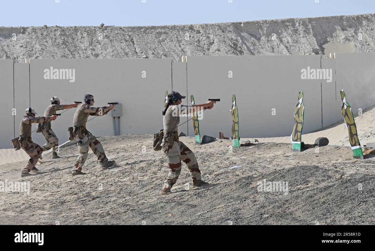 Four French Security Forces Members practice multiple firing positions ...