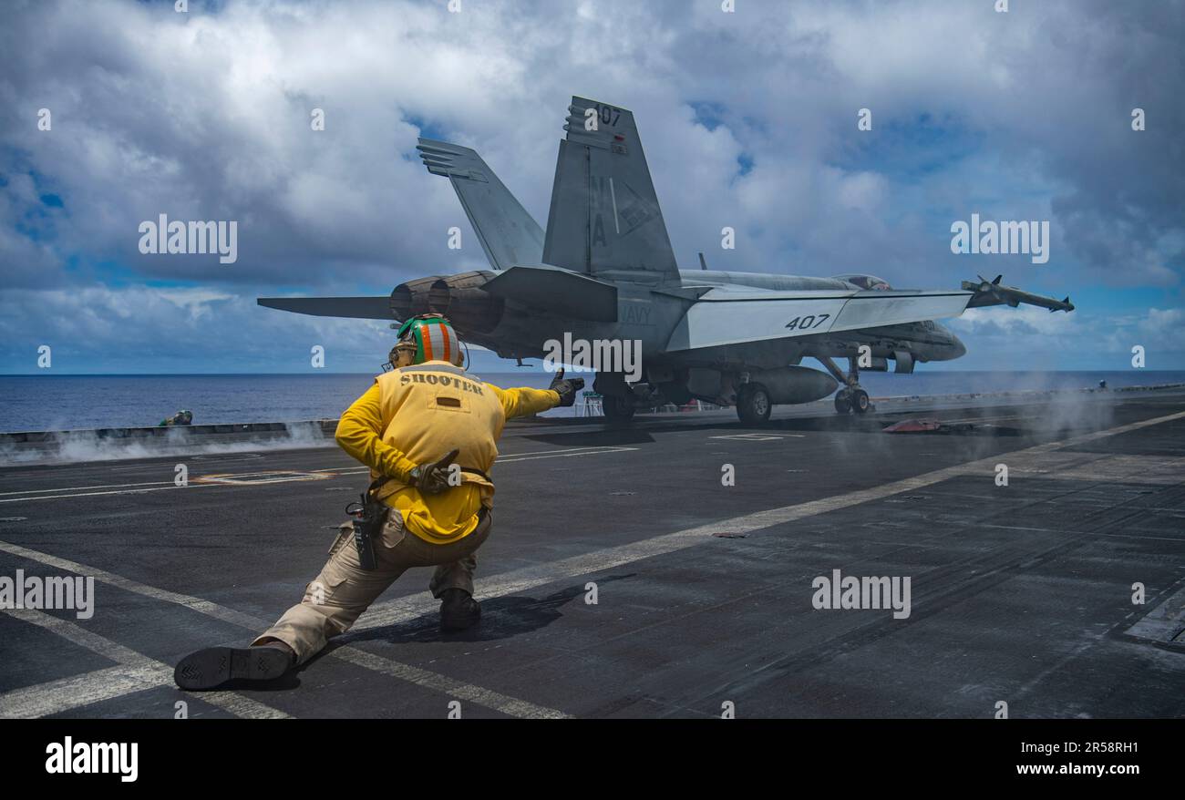230601-N-DU622-1076 PACIFIC OCEAN (June 1, 2023) A U.S. Navy Sailor launches an F/A-18E Super ...
