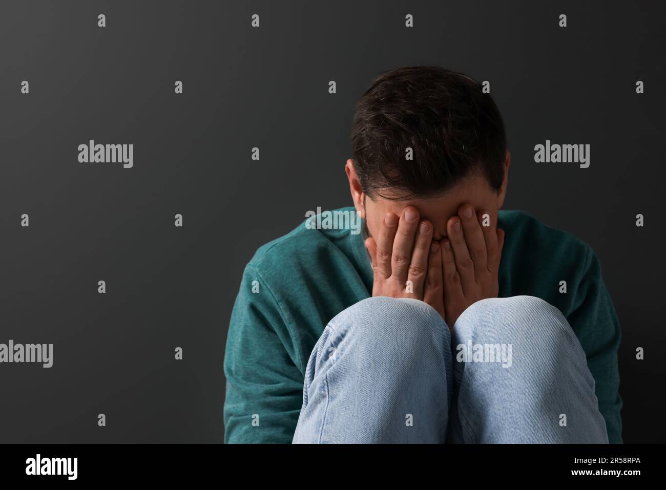 Upset man sitting on hi-res stock photography and images - Alamy