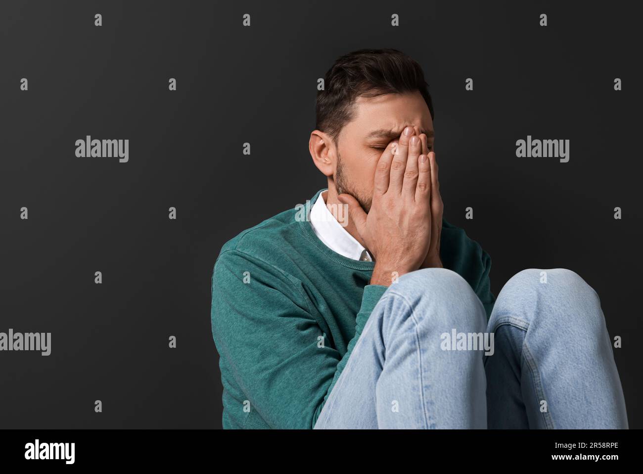 Upset man sitting on hi-res stock photography and images - Alamy