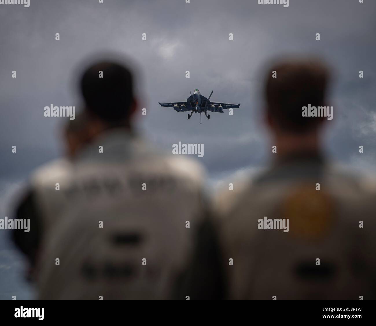 230601-N-MH015-1164 PACIFIC OCEAN (June 1, 2023) U.S. Navy Sailors observe an F/A-18E Super ...