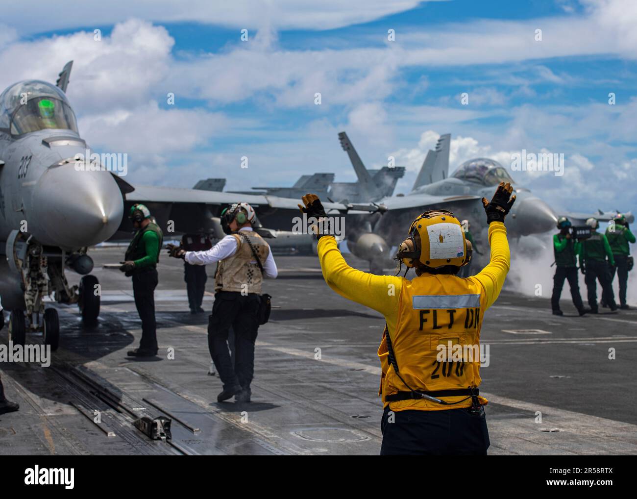 230601-N-MH015-1079 PACIFIC OCEAN (June 1, 2023) A U.S. Navy Sailor directs an F/A-18F Super ...