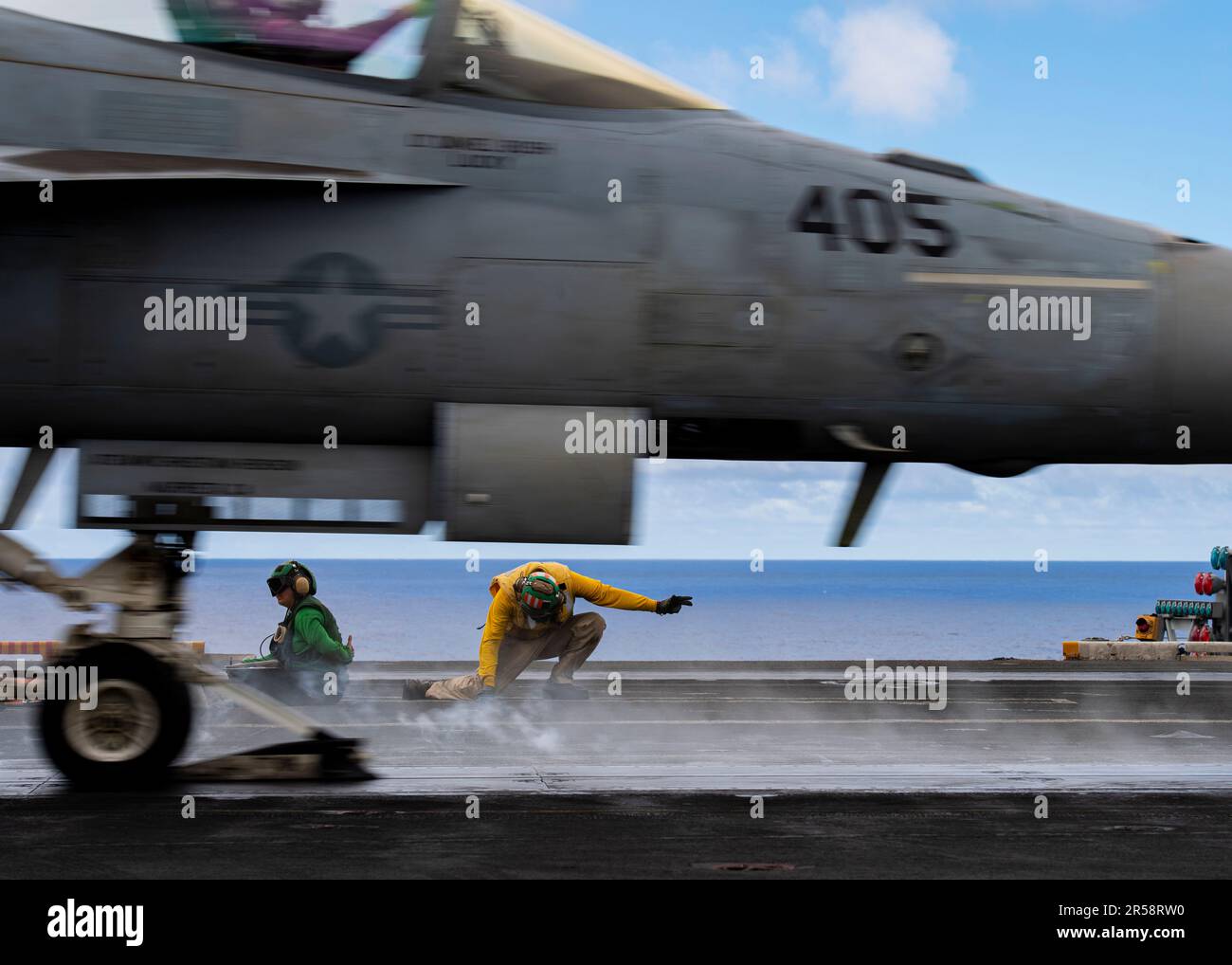230601-N-MH015-1086 PACIFIC OCEAN (June 1, 2023) A U.S. Navy Sailor launches an F/A-18E Super ...