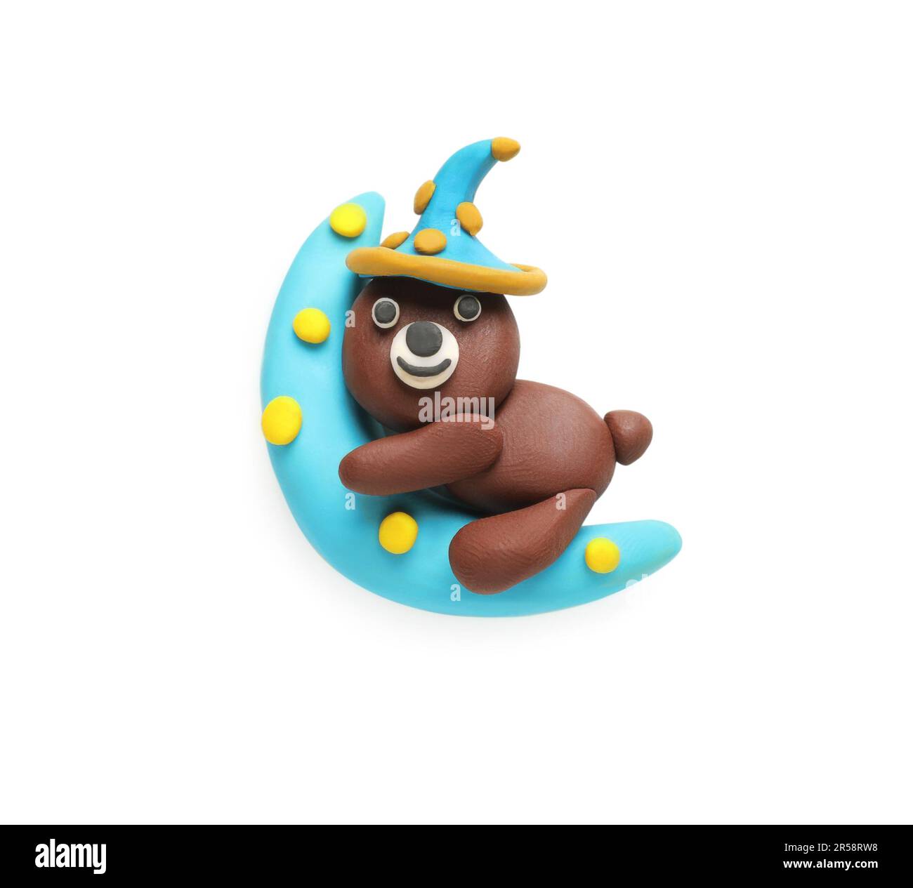 Beautiful bear and moon made of plasticine isolated on white, top view ...