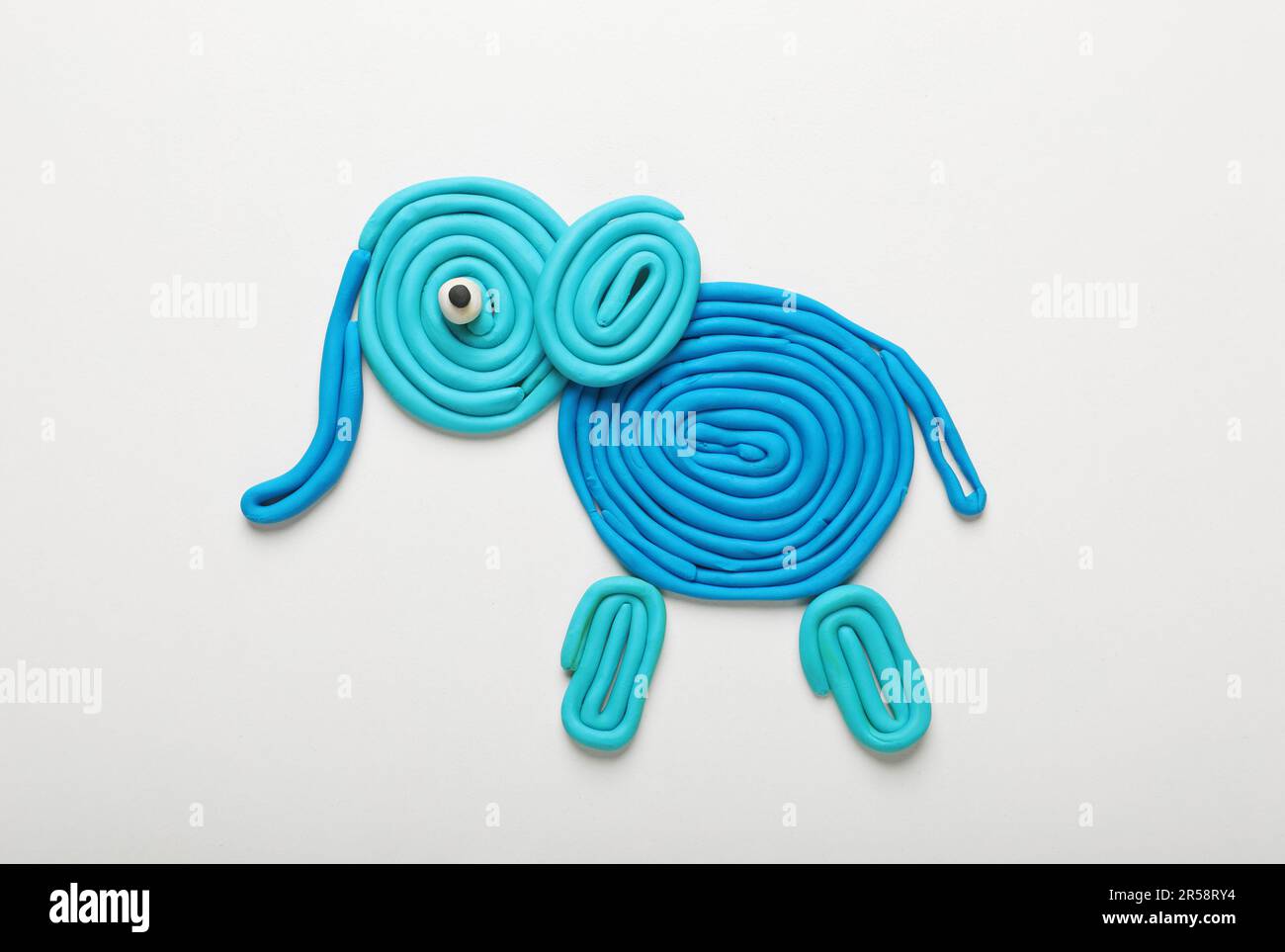 Light blue plasticine elephant isolated on white, top view Stock Photo ...