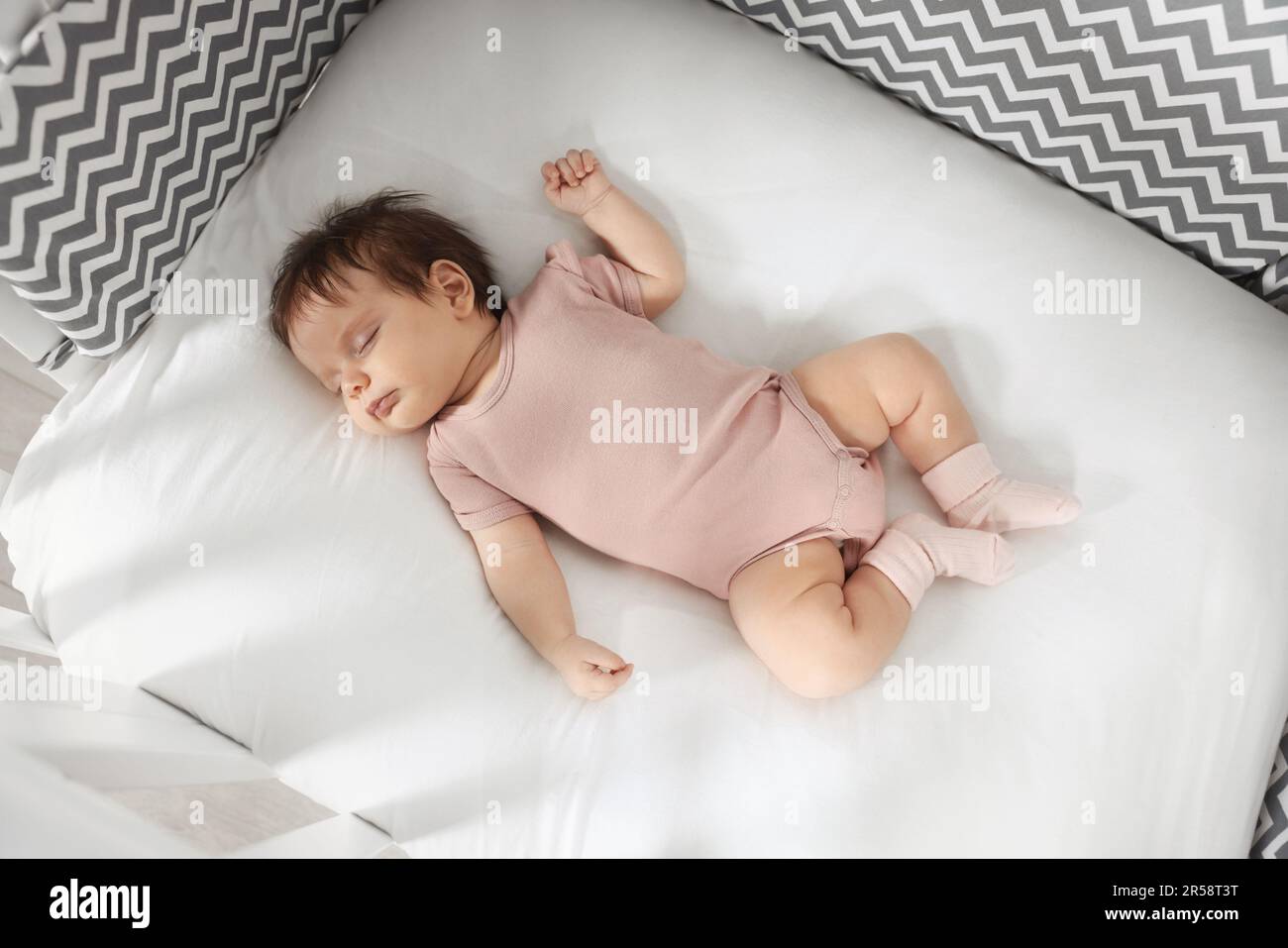 Cute little baby sleeping on cosy bed, top view Stock Photo - Alamy
