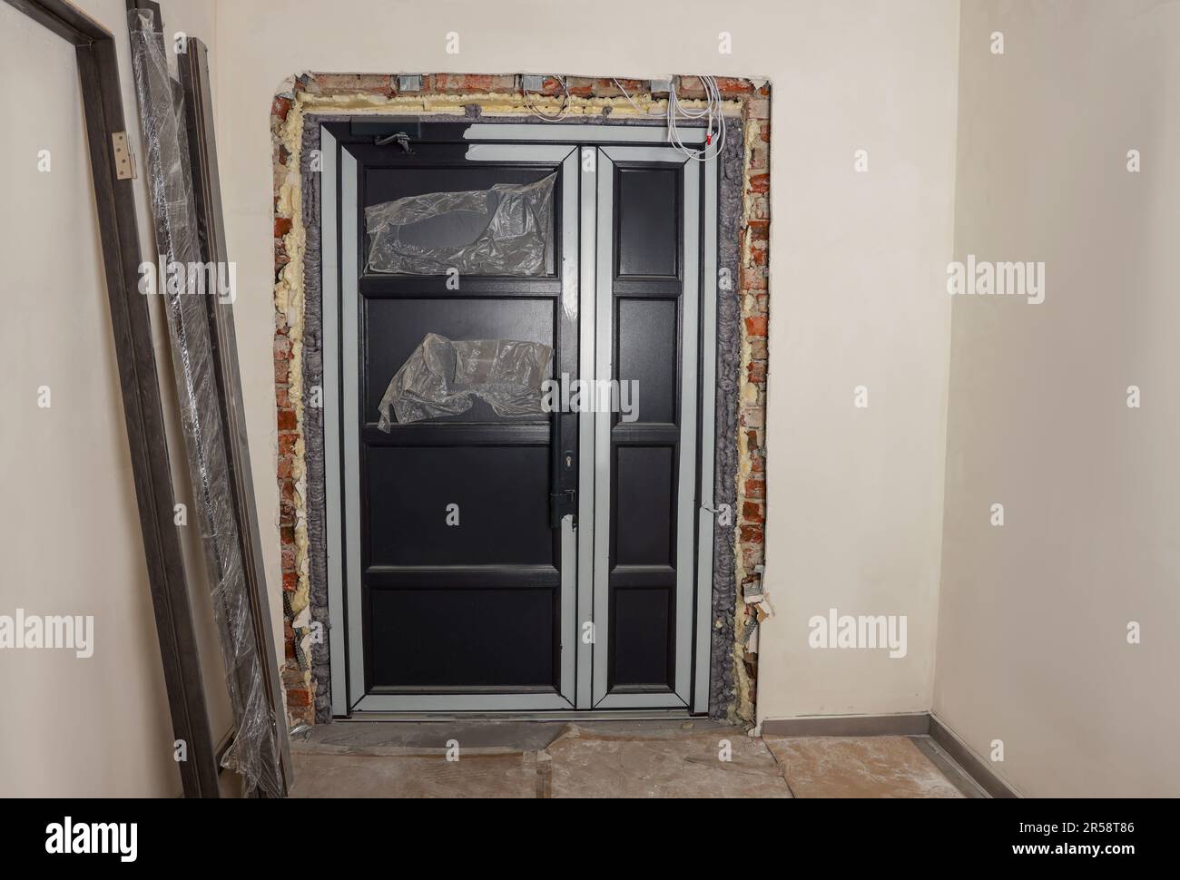 Cables in wall near doors indoors. Installation of electrical wiring ...