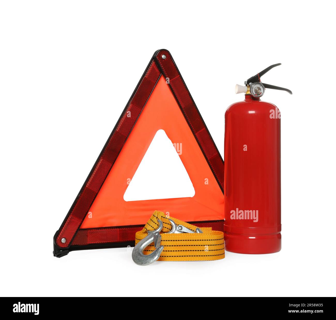 Emergency warning triangle, towing strap and red fire extinguisher on ...