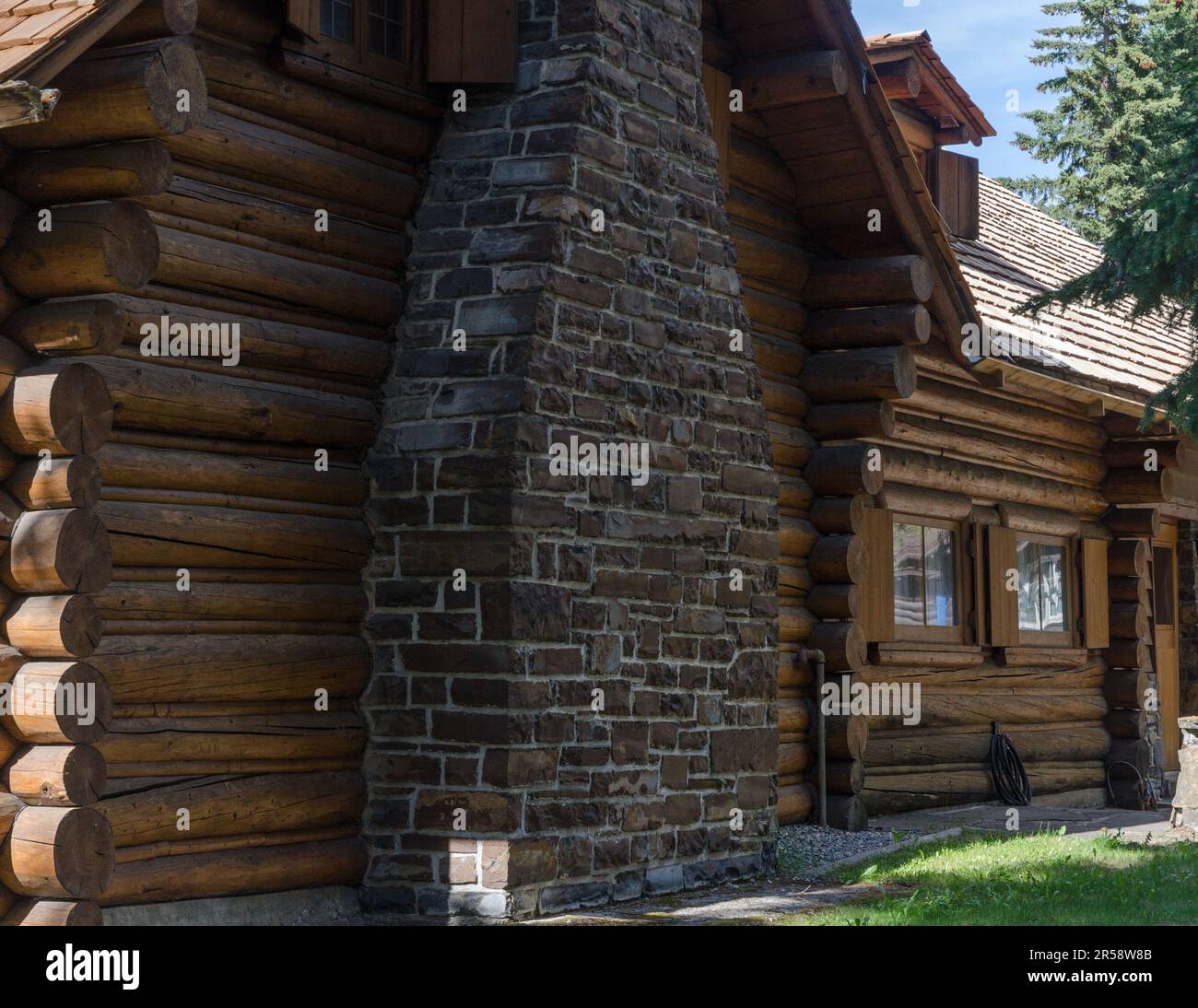 An historic log cabin on the Whyte Museum property in downtown Banff ...