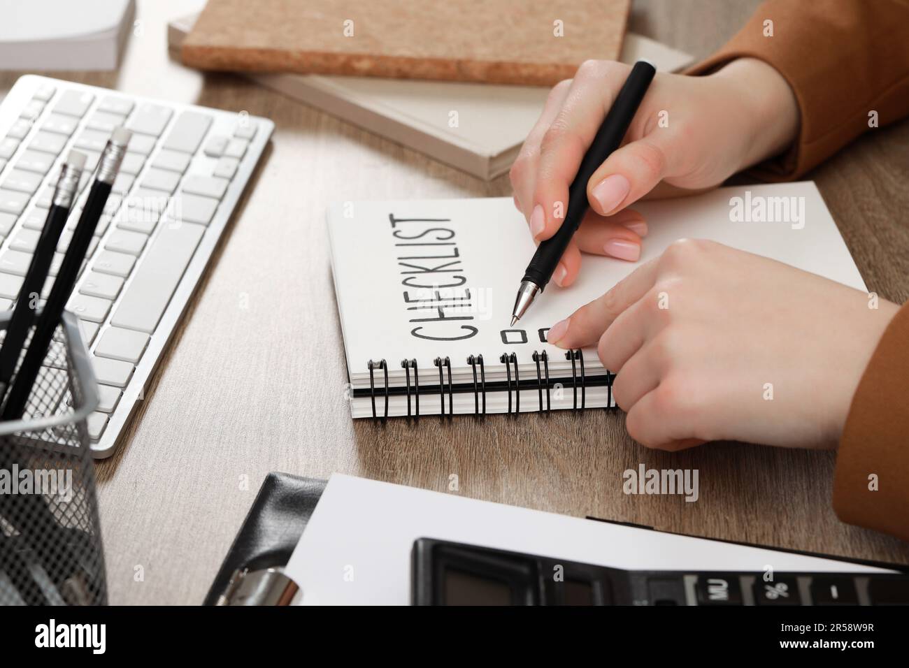 Woman filling checklist table hi-res stock photography and images - Alamy