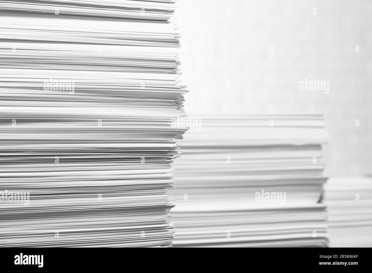 Stacks of paper sheets on white background, space for text Stock Photo ...