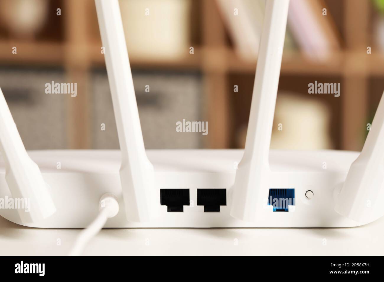 New Wi-Fi router on white table indoors, back view Stock Photo - Alamy