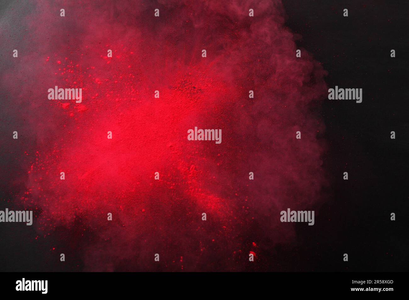 Red powder dye on dark background, top view. Holi festival Stock Photo ...