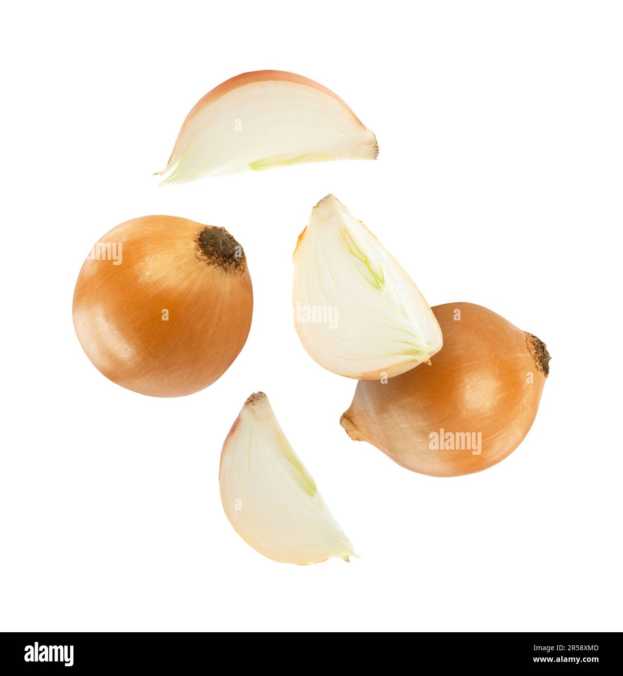 Whole and cut onion bulbs falling on white background Stock Photo - Alamy