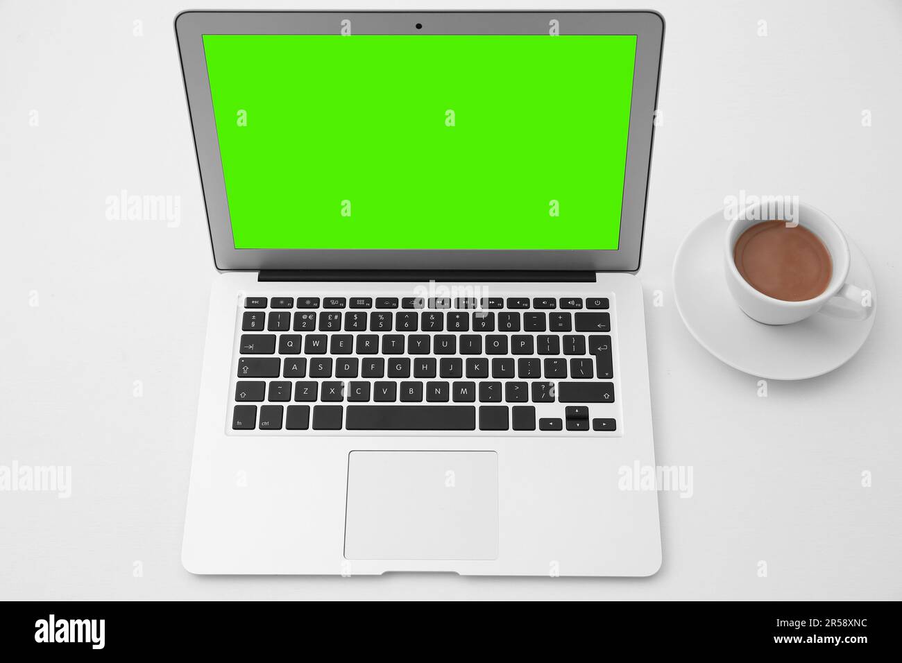 Laptop display with chroma key on desk. Comfortable workplace with ...