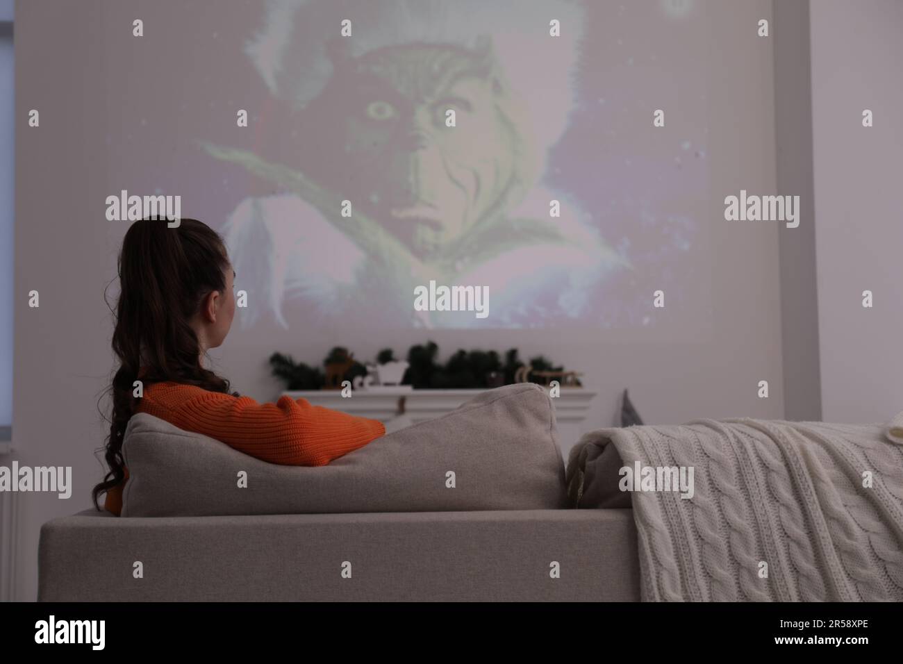 Lviv, Ukraine – January 24, 2023: Woman watching How the Grinch Stole ...